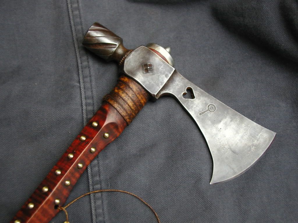 What s the meaning of the bleeding heart on some tomahawk heads? | BladeForums.com